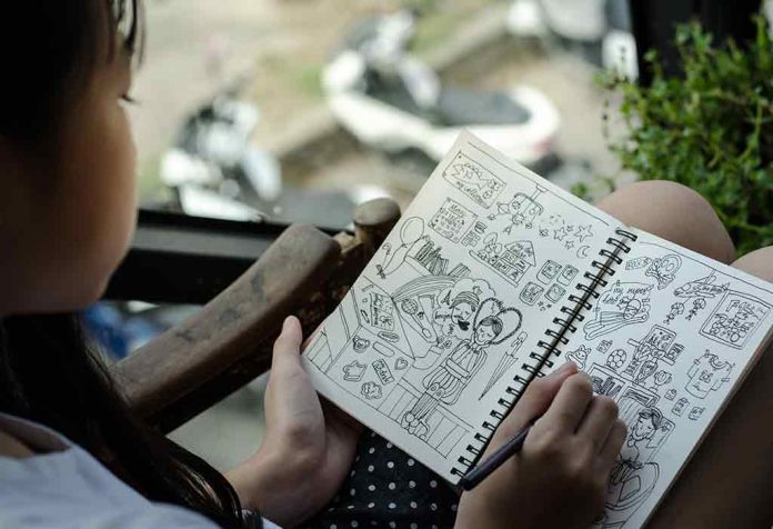 child doodling in notebook